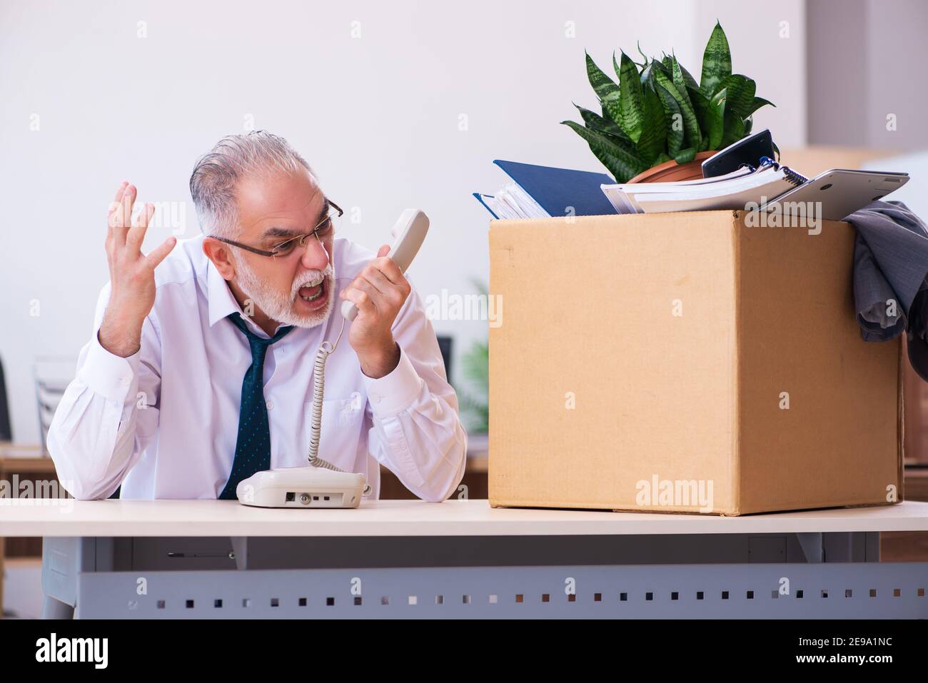 Old employee being fired from his work Stock Photo - Alamy