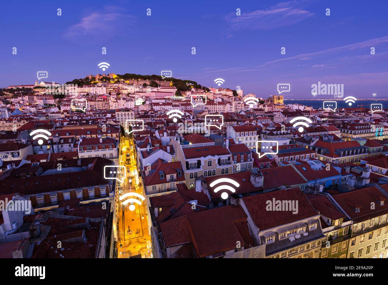 View of downtown Lisbon, Portugal, from above at dusk. Wireless network ...
