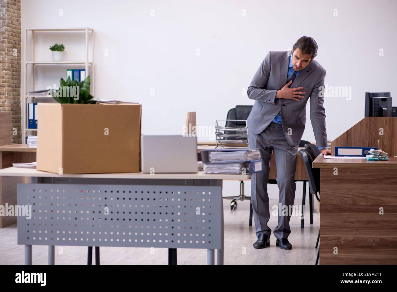 Young employee being fired from his work Stock Photo - Alamy