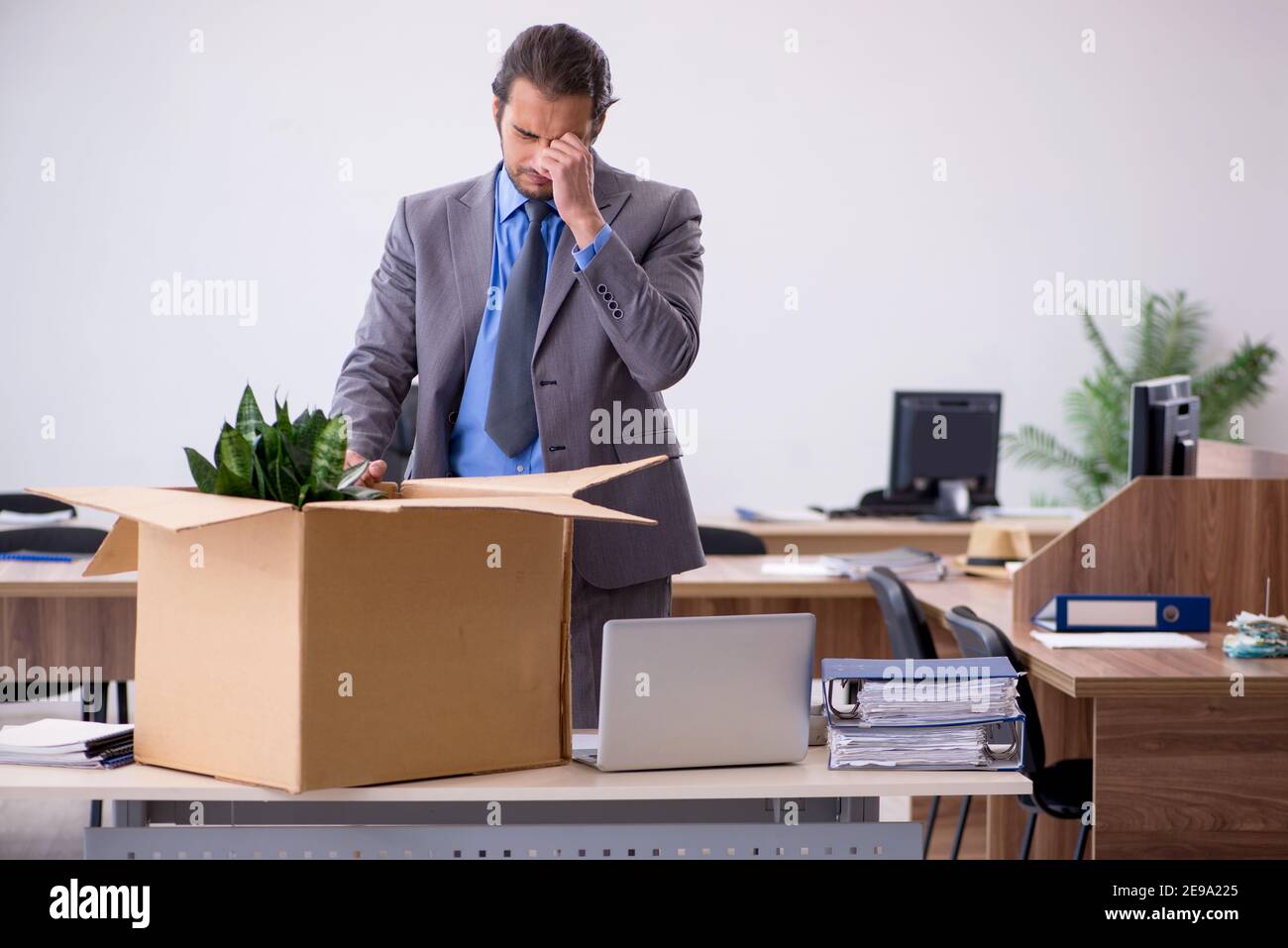 Young employee being fired from his work Stock Photo - Alamy