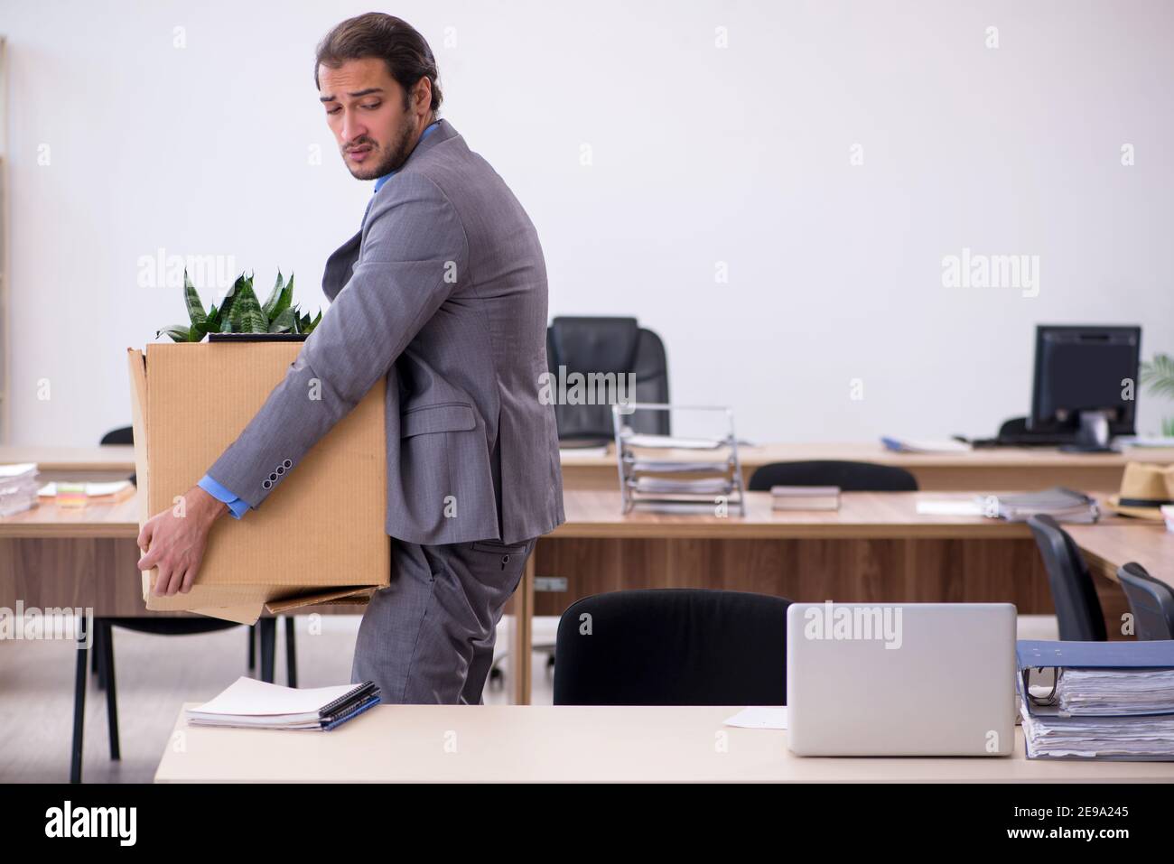Young employee being fired from his work Stock Photo - Alamy
