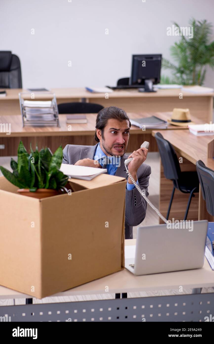 Young employee being fired from his work Stock Photo - Alamy