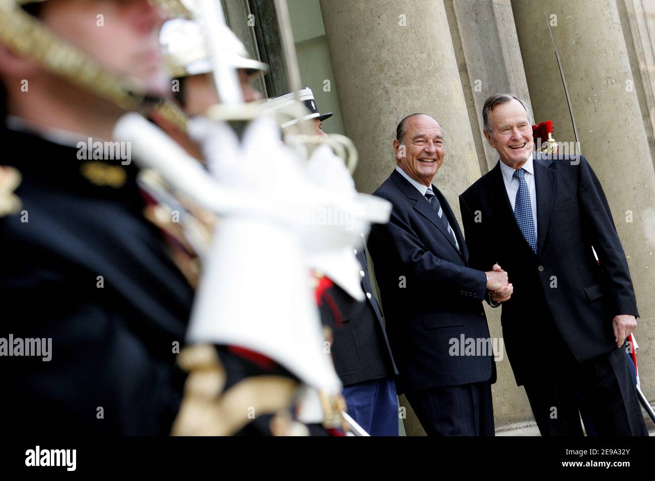 President Jacques Chirac receives former US President George Bush at ...
