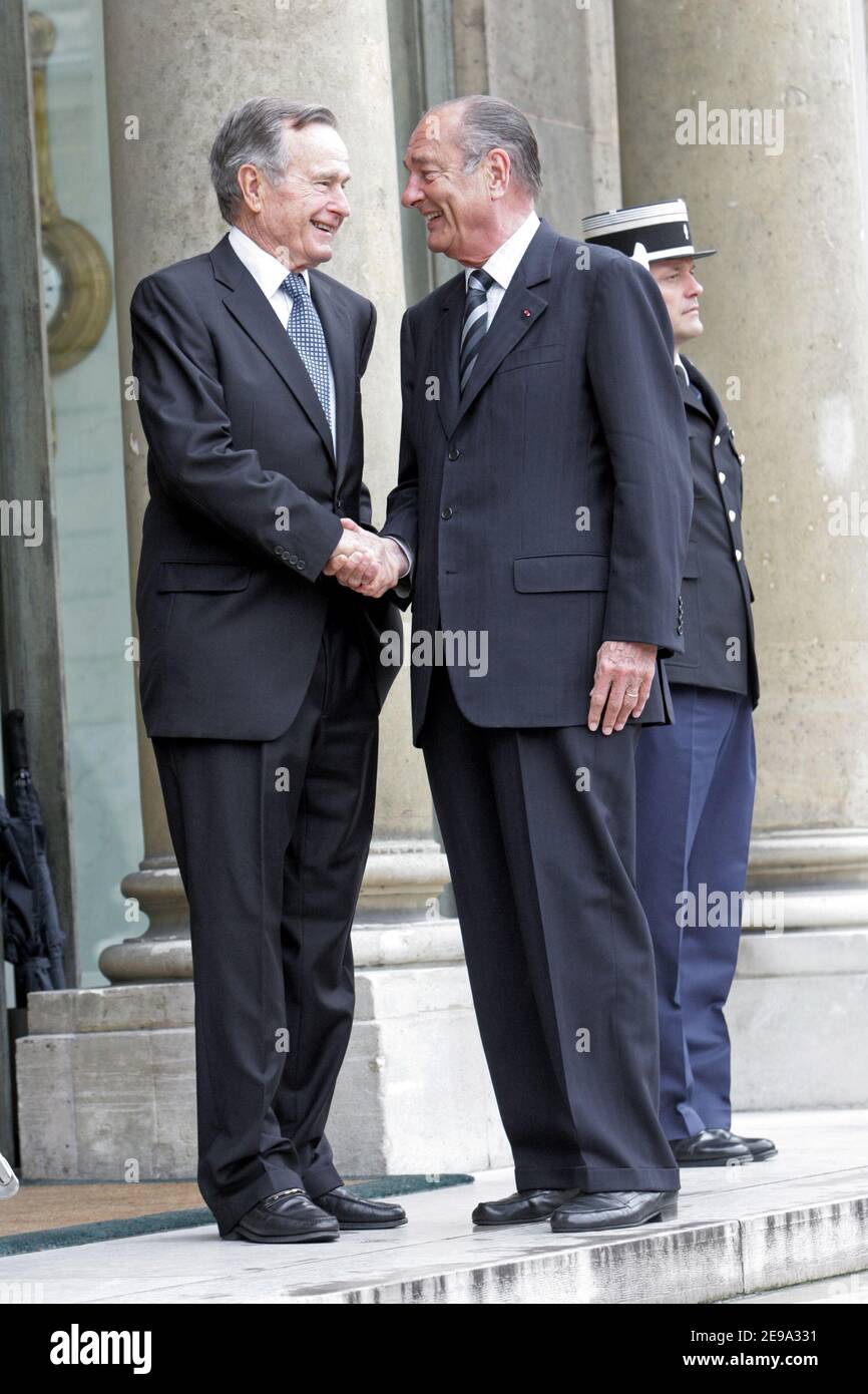 President Jacques Chirac receives former US President George Bush at ...