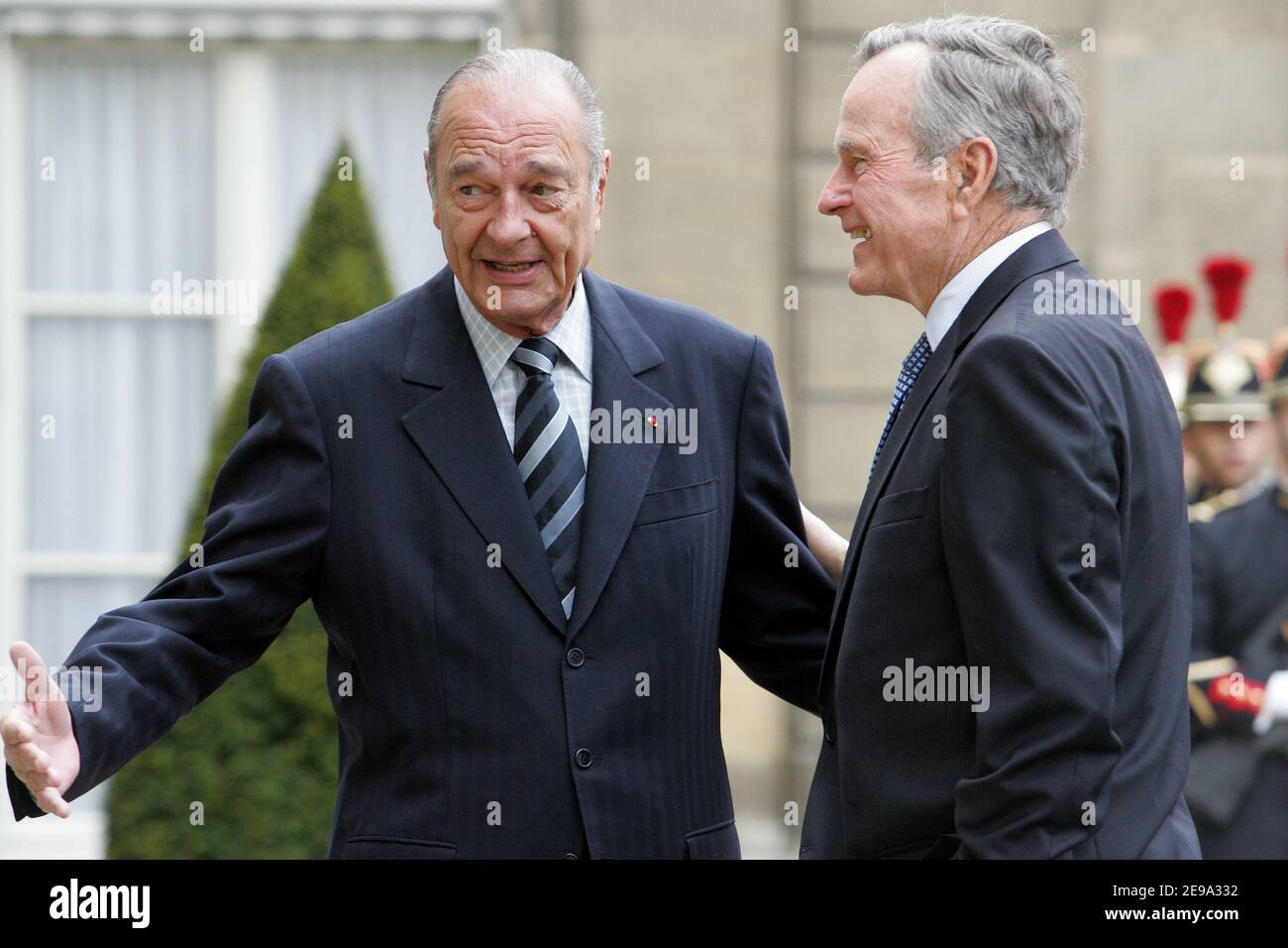 President Jacques Chirac receives former US President George Bush at ...