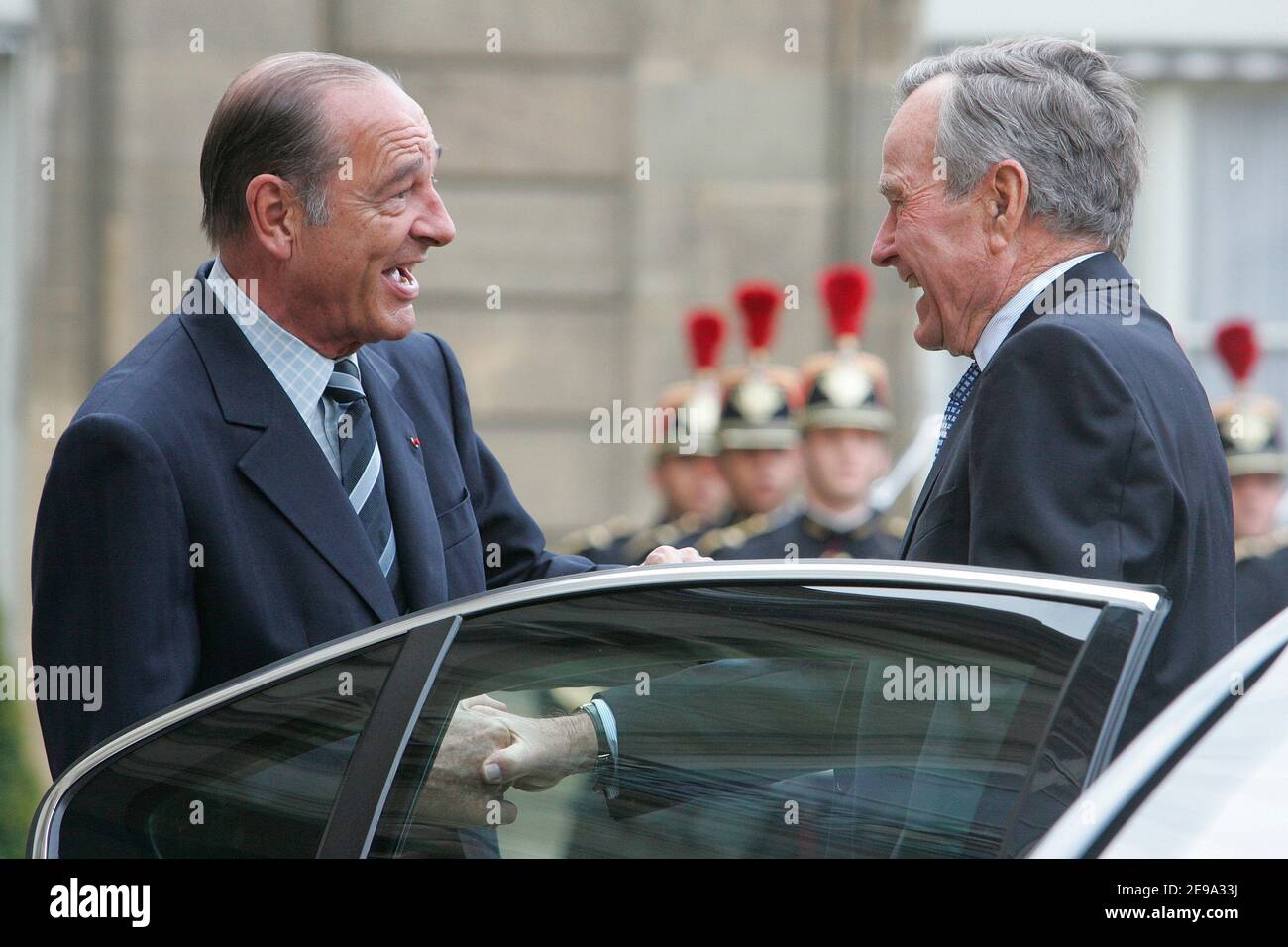 President Jacques Chirac receives former US President George Bush at ...