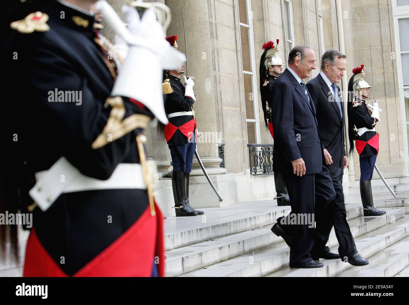 President Jacques Chirac receives former US President George Bush at ...