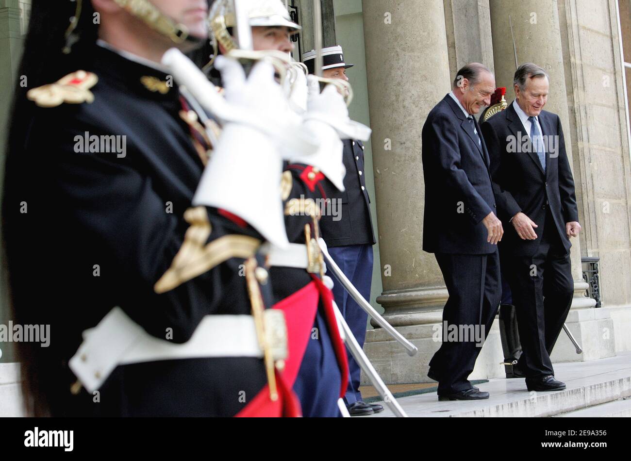 President Jacques Chirac receives former US President George Bush at ...