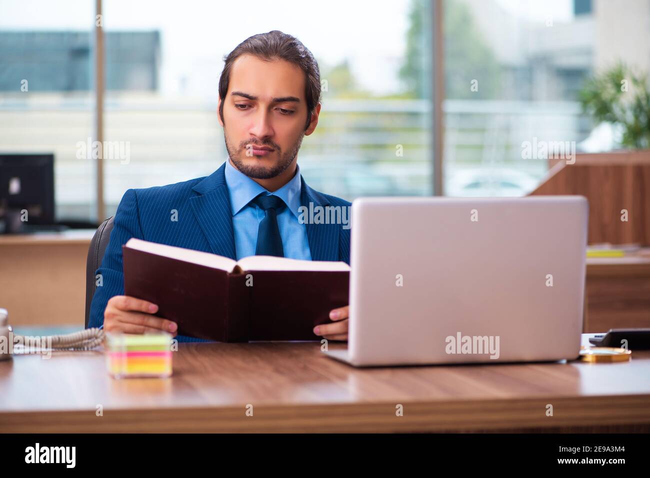 Young man handbook office hi-res stock photography and images - Alamy