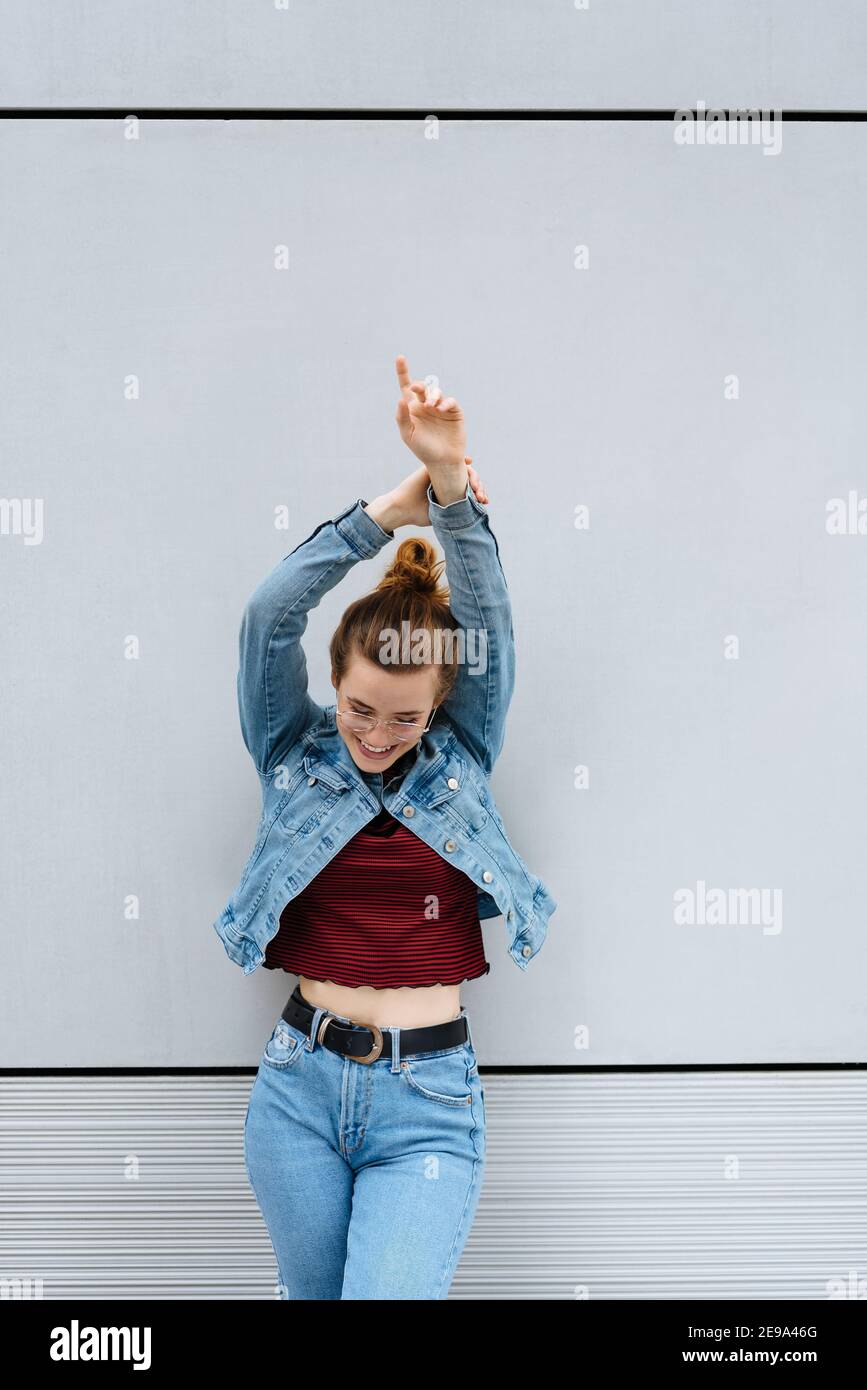 Woman stretching arms above head hi-res stock photography and images ...