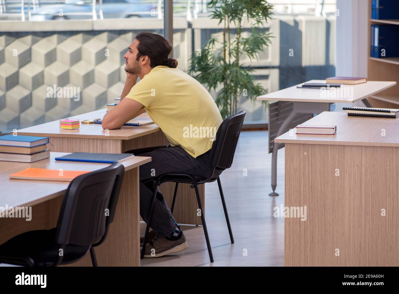 Male student sitting in the classroom Stock Photo - Alamy