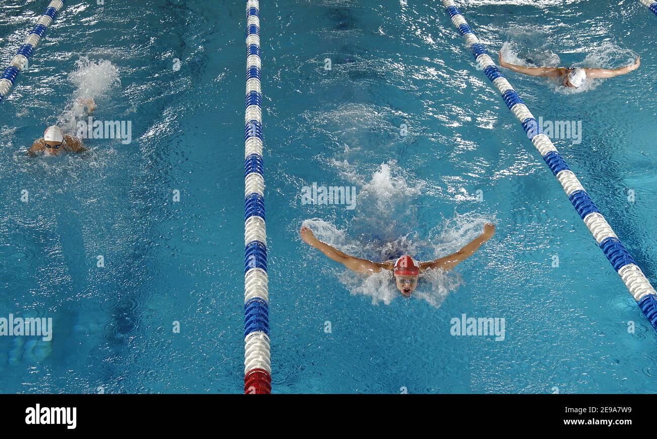 France's Aurore Mongel competes on women's 100 meters butterfly during ...