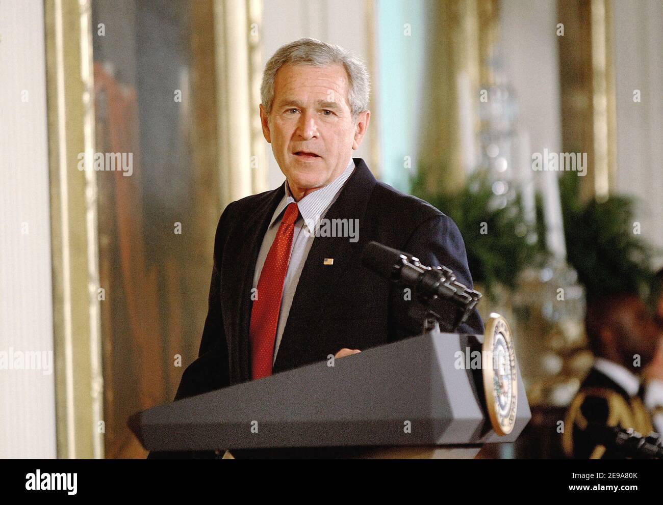 US President George W. Bush is seen between two guests during a ...