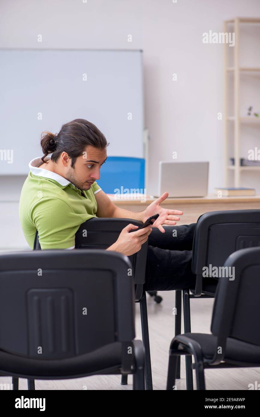 Young student in business presentation concept Stock Photo - Alamy