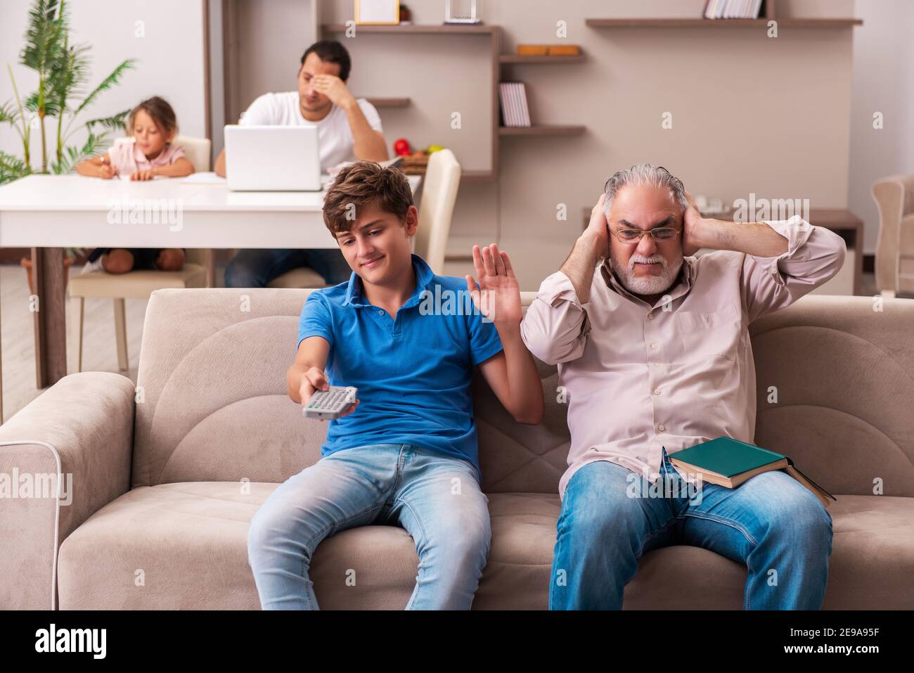 Three generations at home in early development concept Stock Photo - Alamy