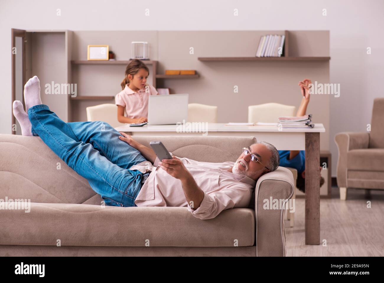 Three generations at home in early development concept Stock Photo - Alamy