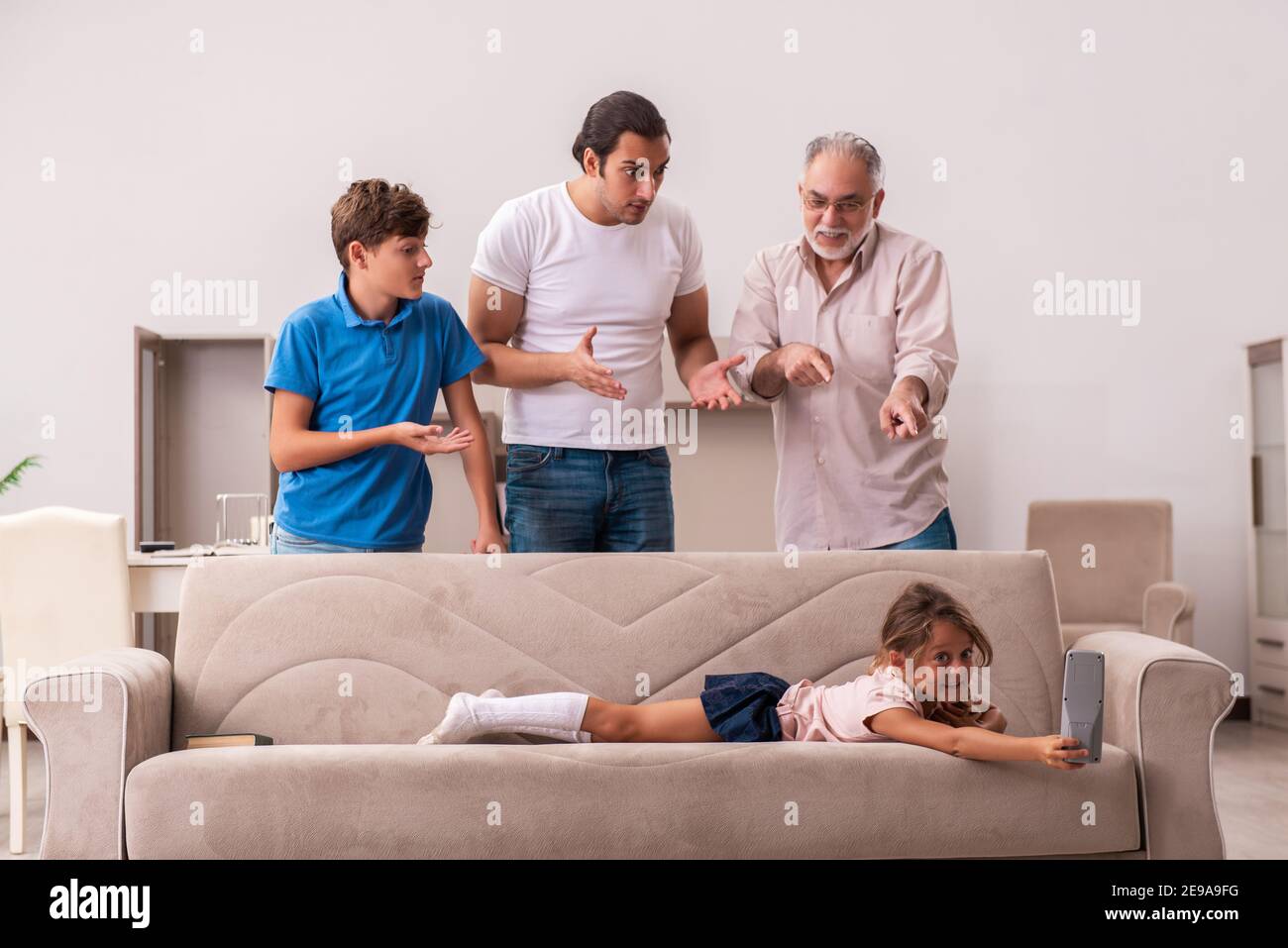 Three generations at home in early development concept Stock Photo - Alamy