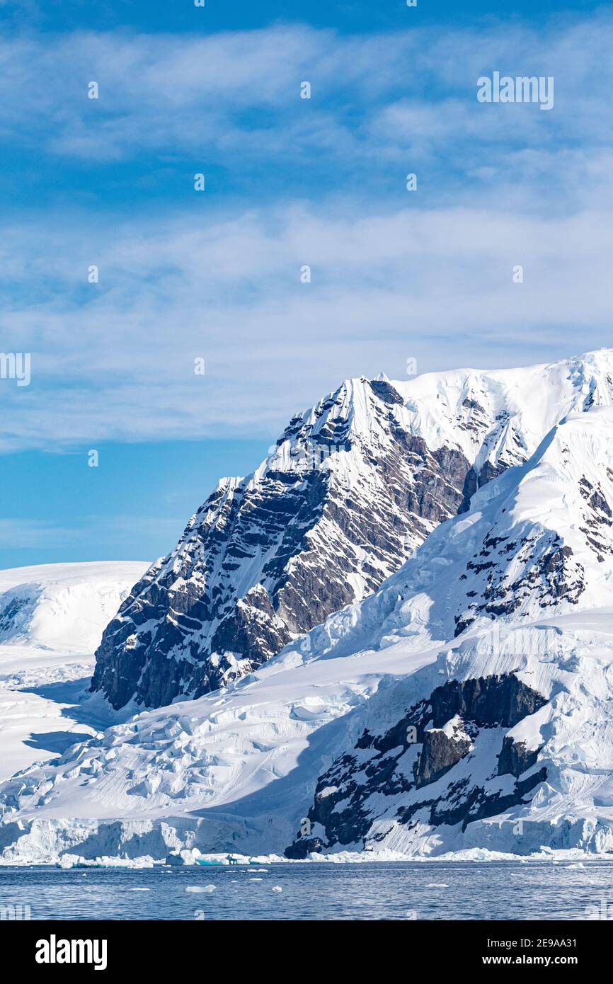 Snow-covered mountains, glaciers, and icebergs in Lindblad Cove ...