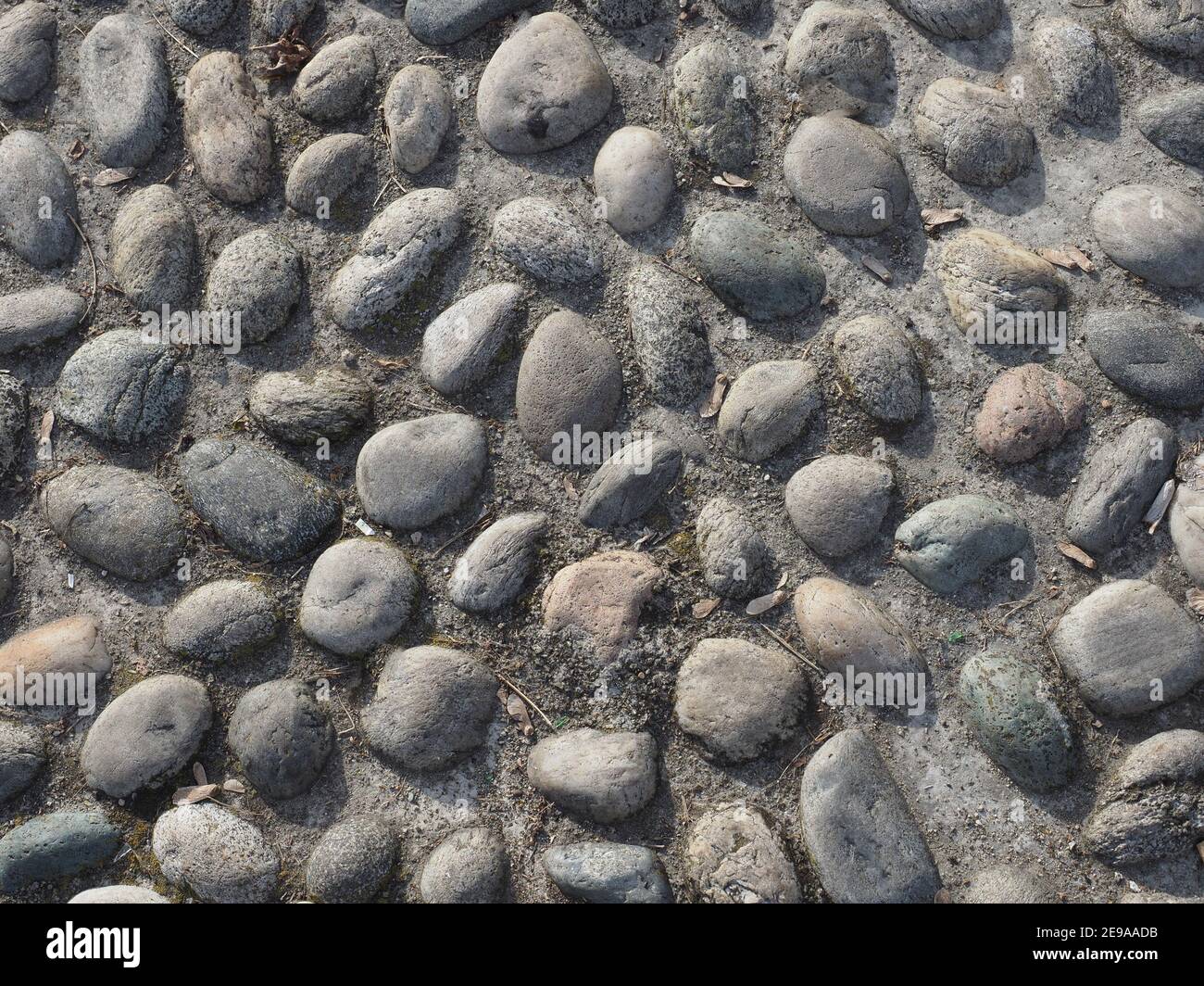 grey stone pebbles texture useful as a background Stock Photo - Alamy
