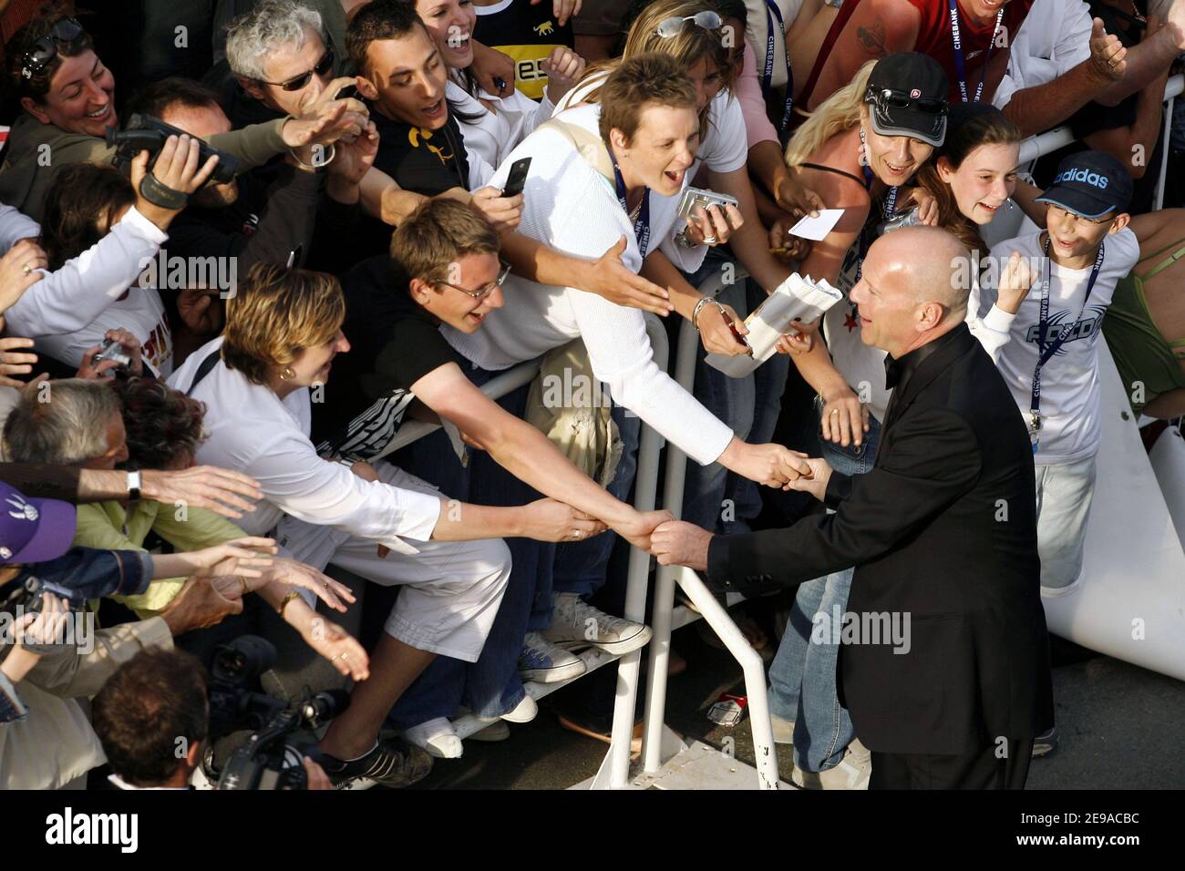 Bruce Willis greets fans on the red carpet prior the screening of the ...