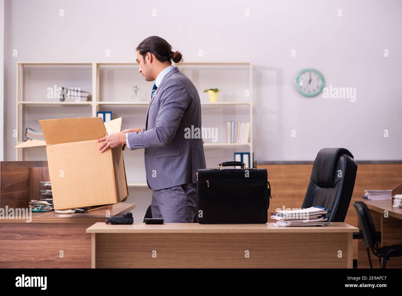 Young employee being dismissed from his work Stock Photo - Alamy