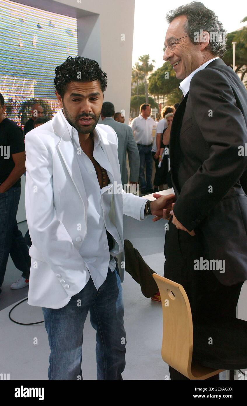 French actor Jamel Debbouze is welcomed by anchorman Michel Denisot on ...