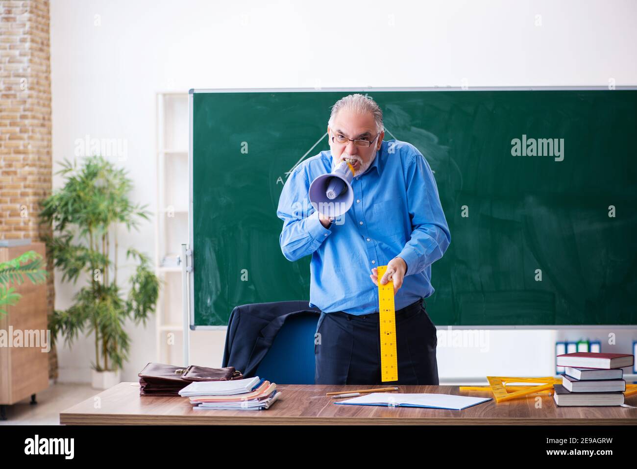 Angry teacher and ruler hi-res stock photography and images - Alamy