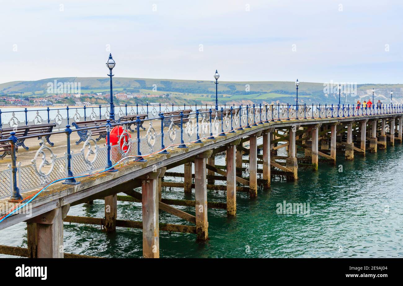 The historic Victorian pier in Swanage Bay at Swanage, Isle of Purbeck ...