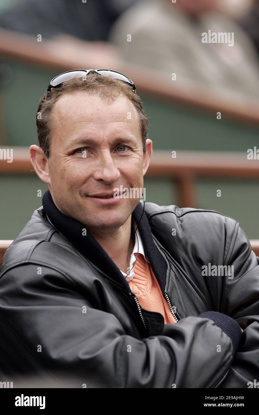 French former soccer player Jean-Pierre Papin watches a game during the ...