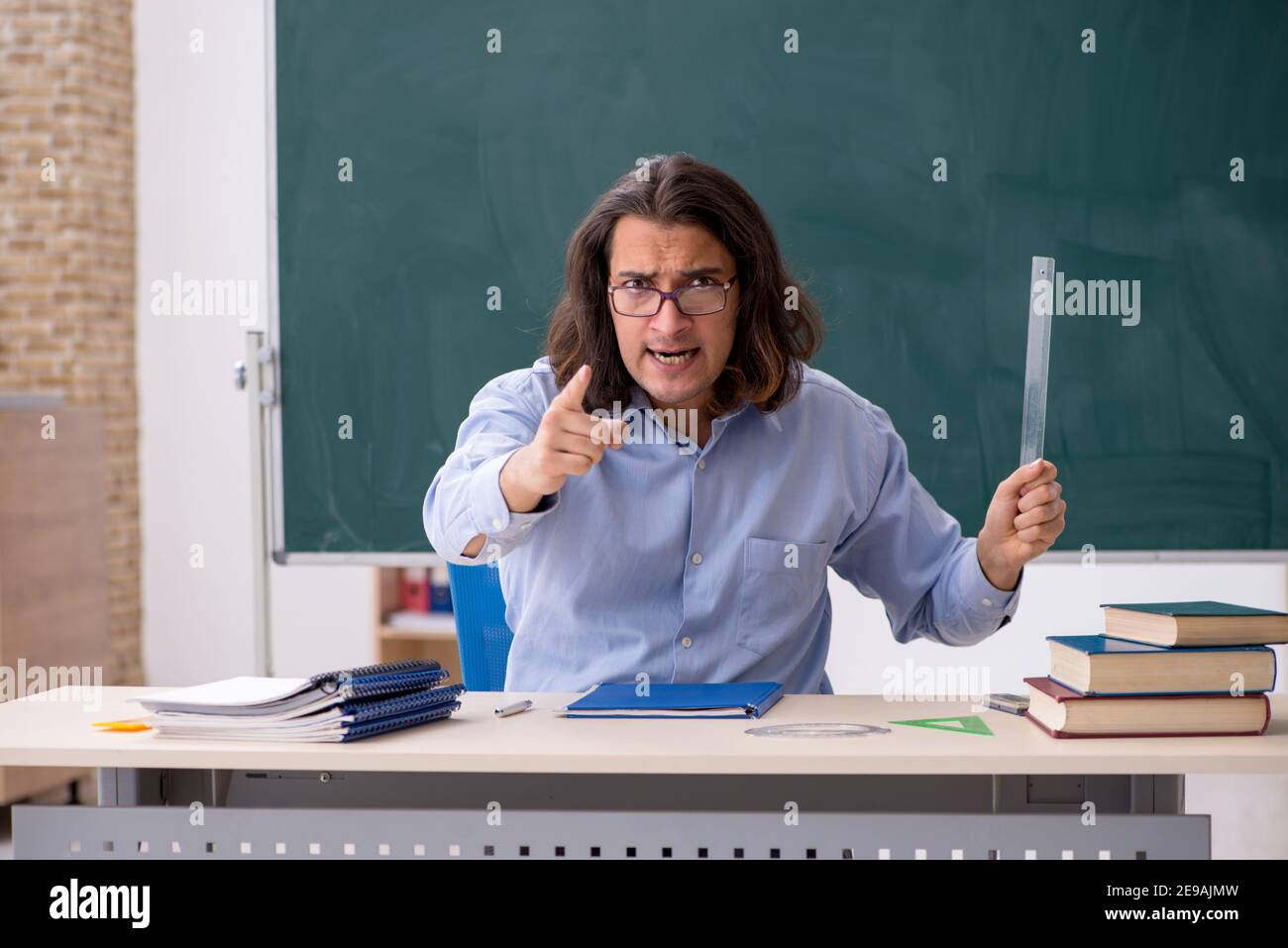 Angry teacher and ruler hi-res stock photography and images - Alamy