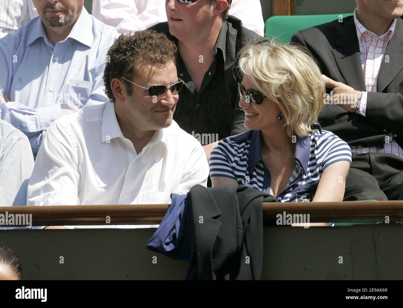 French TV presenter Pierre Sled and his wife Sophie Davant watch a game ...