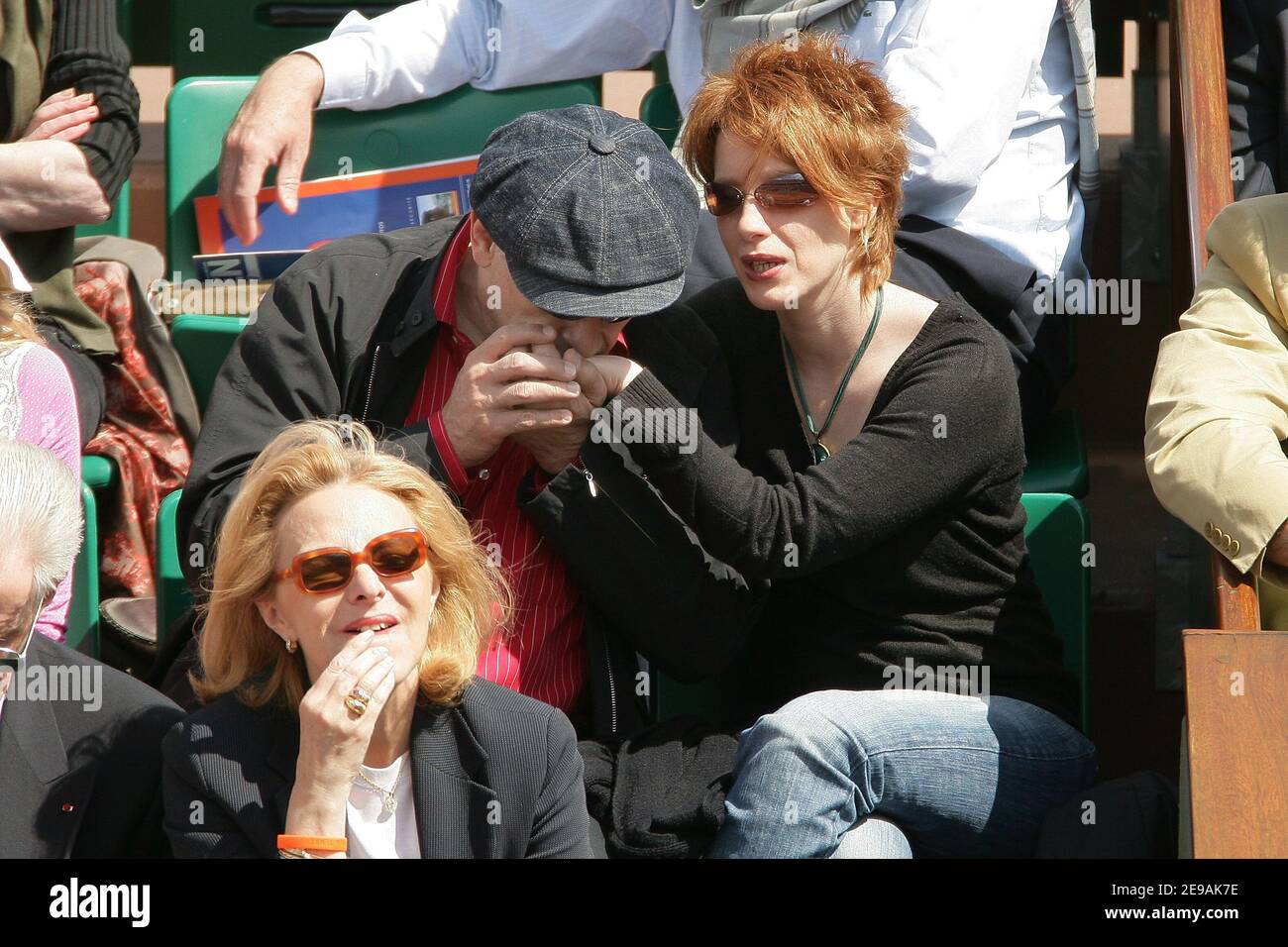 French actor Francis Perrin and his wife Caroline Berg watch a game ...