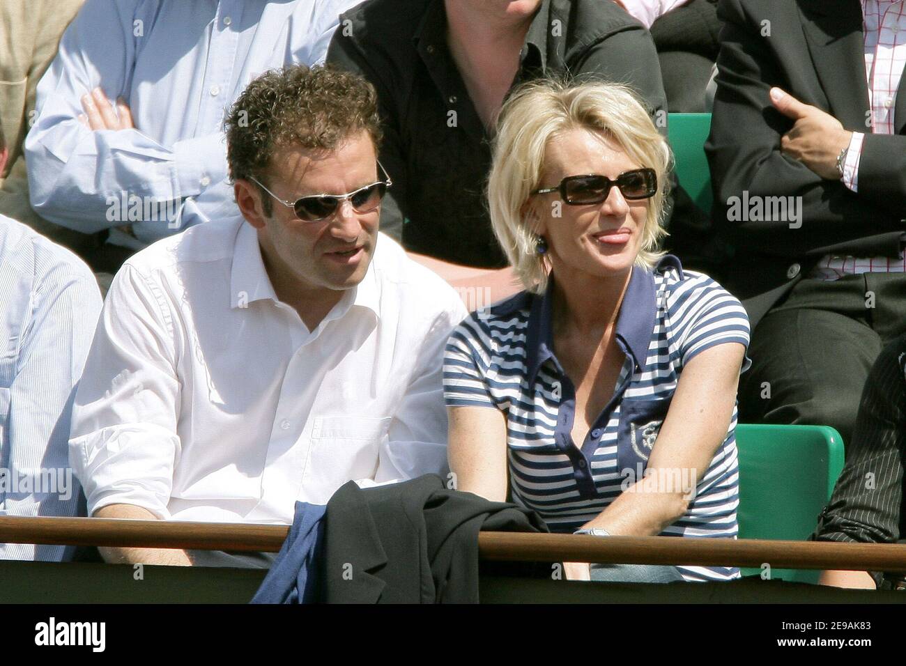 French TV presenter Pierre Sled and his wife Sophie Davant watch a game ...