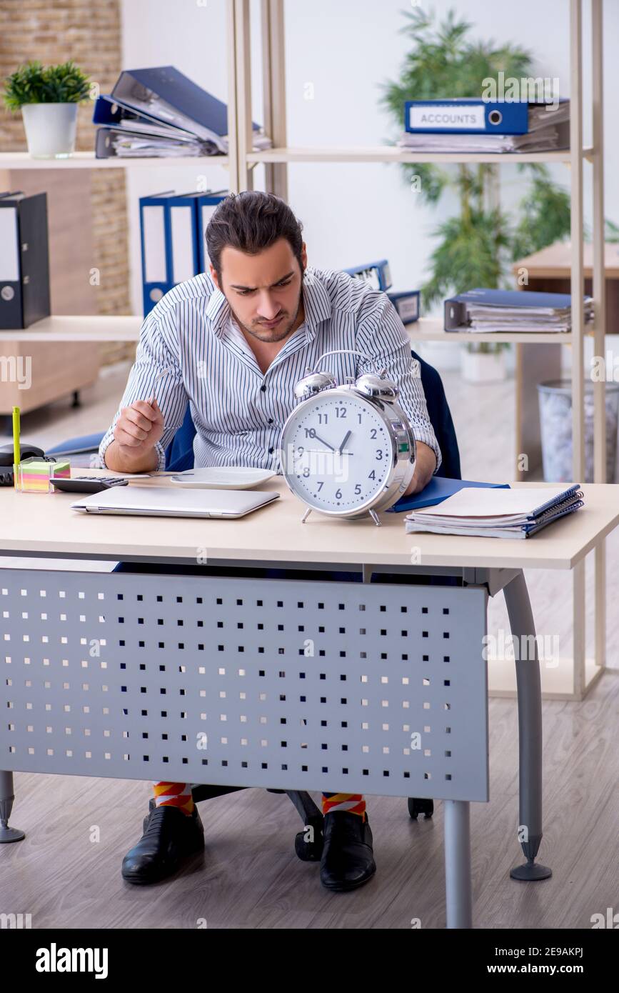 Hungry employee waiting for food in time management concept Stock Photo ...