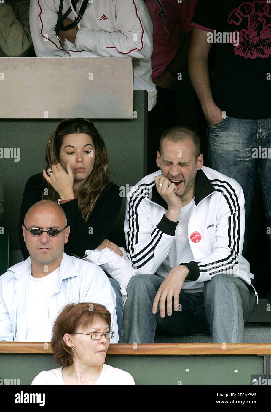 French humorist Fred and his girlfriend watch a game during the 6th day ...