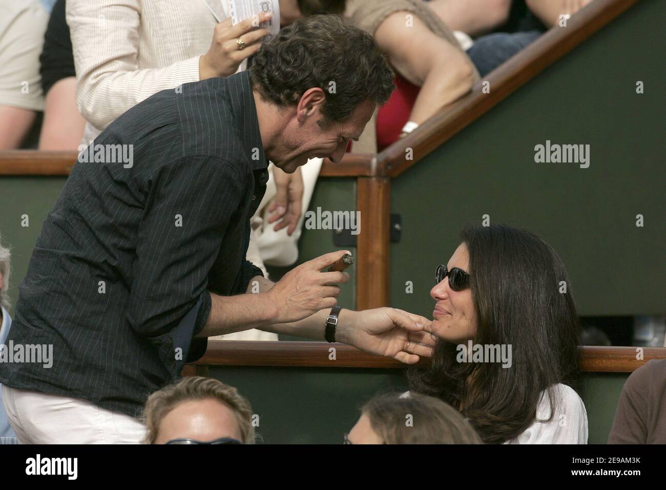 French actor Stephane Freiss and his wife Ursula watch a game during ...
