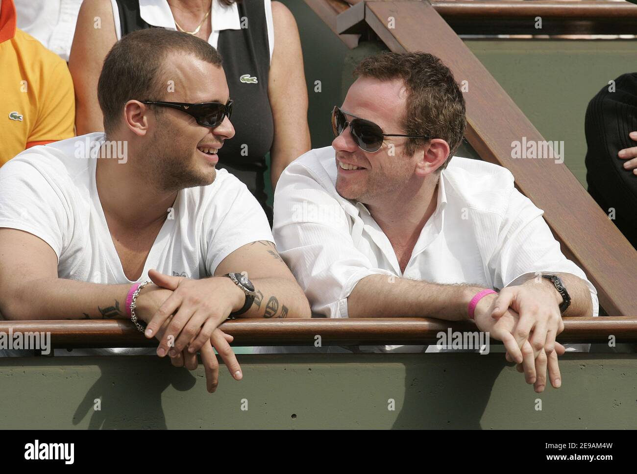 Canadian singer Garou and a friend watch a game during the 7th day of ...