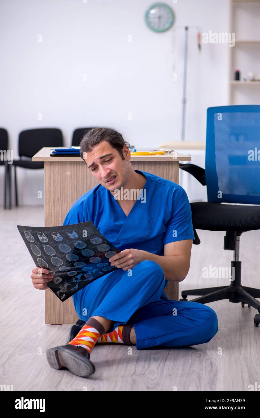 Young doctor radiologist being unhappy after night shift Stock Photo ...