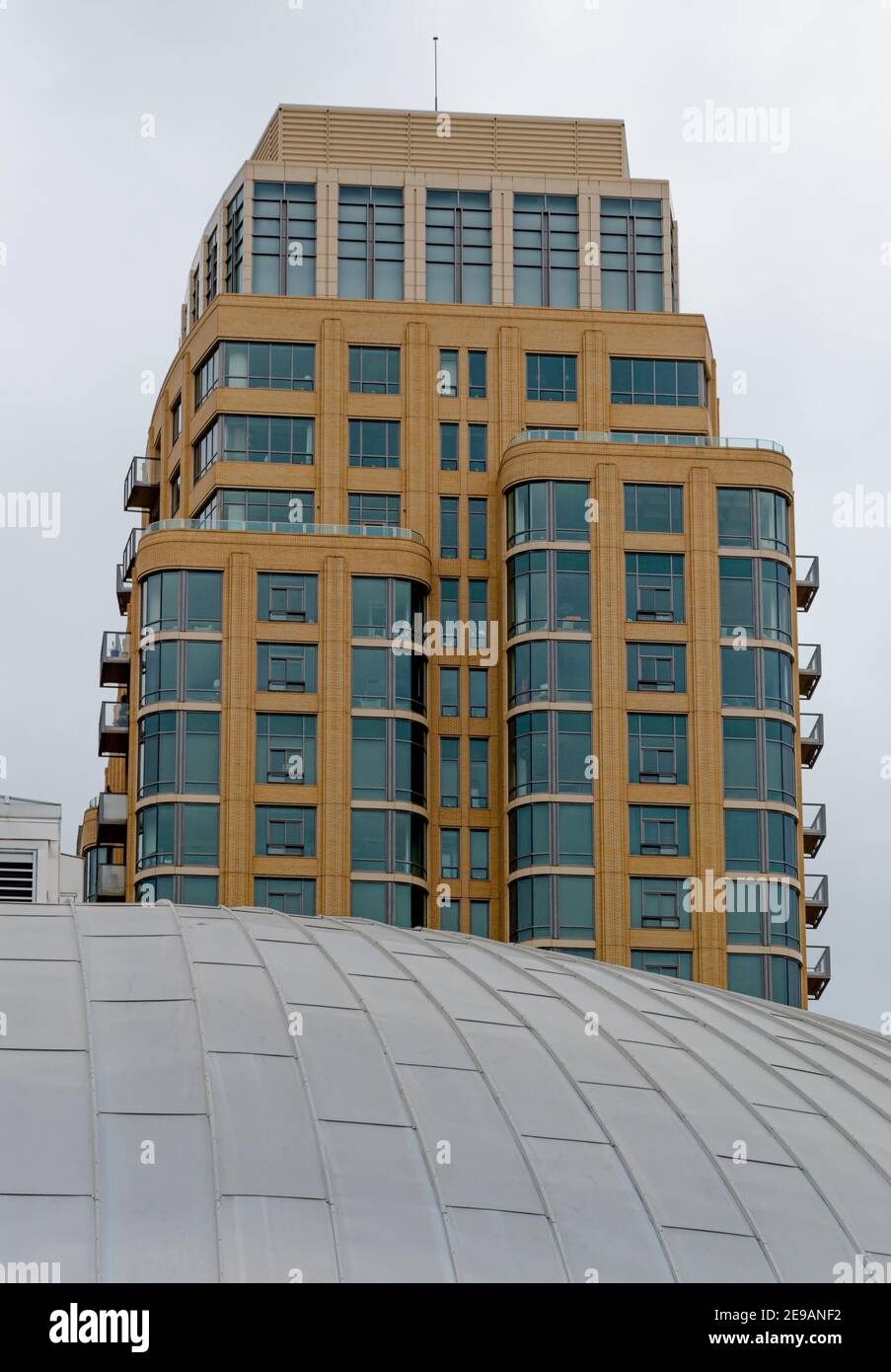 Vertical shot of a beautiful high-rise building with glasses and ...