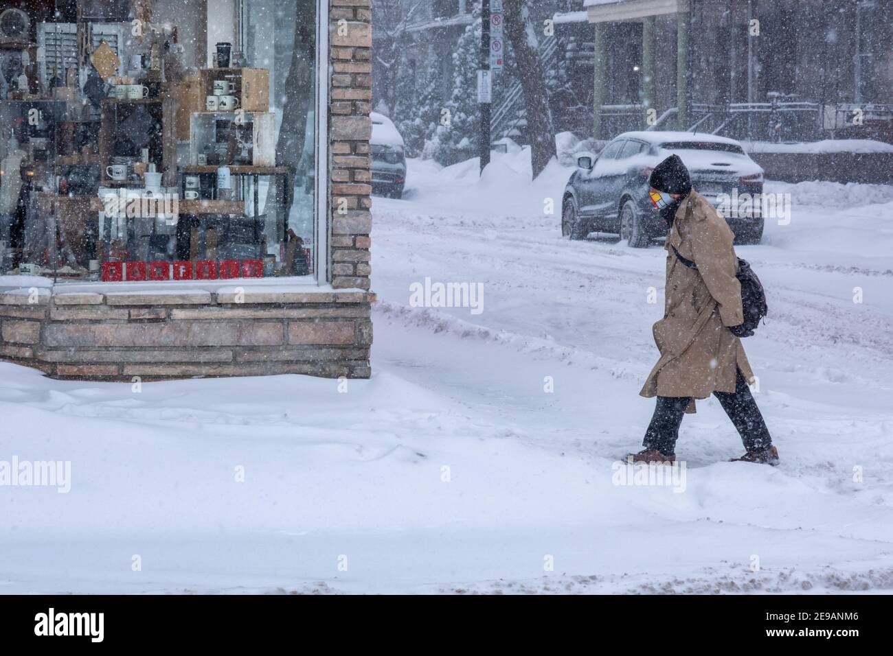Montreal, CA - 2 February 2021: Man with protective face mask walking ...