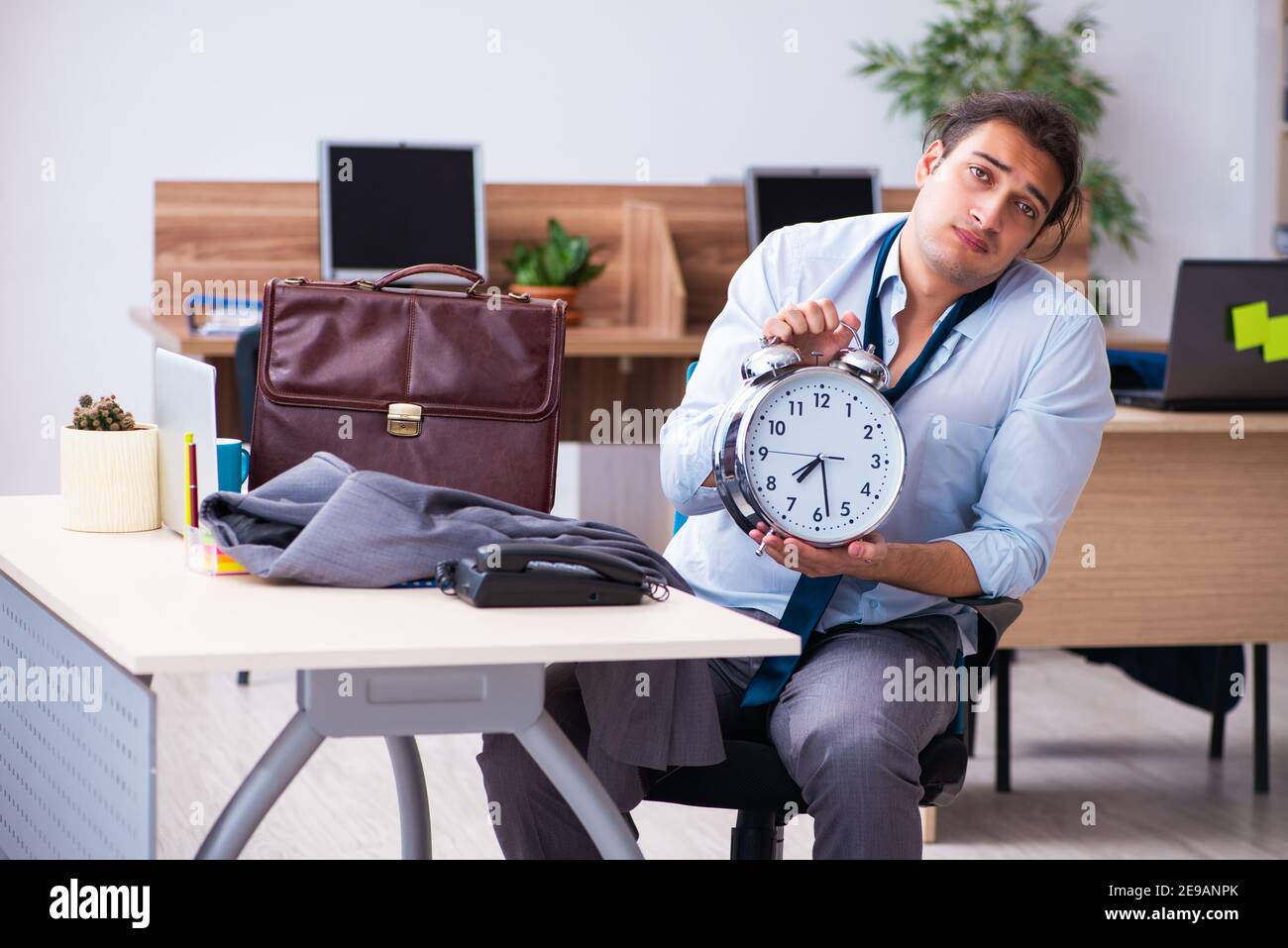 Male employee being late for his job Stock Photo - Alamy