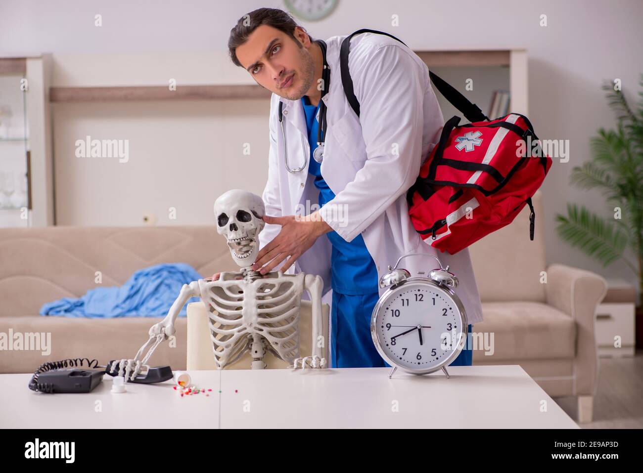 Male paramedic visiting skeleton patient Stock Photo - Alamy