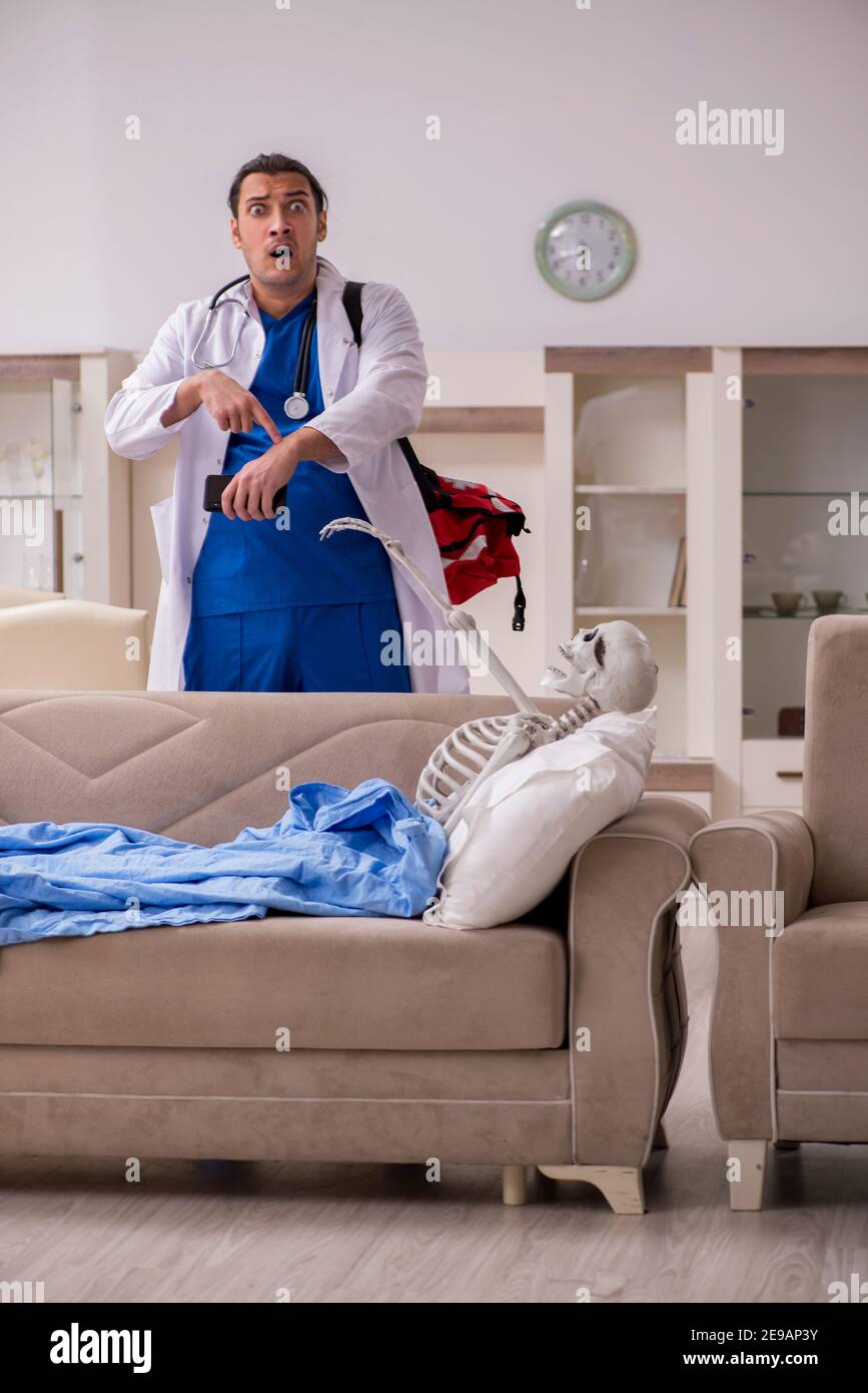 Male paramedic visiting skeleton patient Stock Photo - Alamy