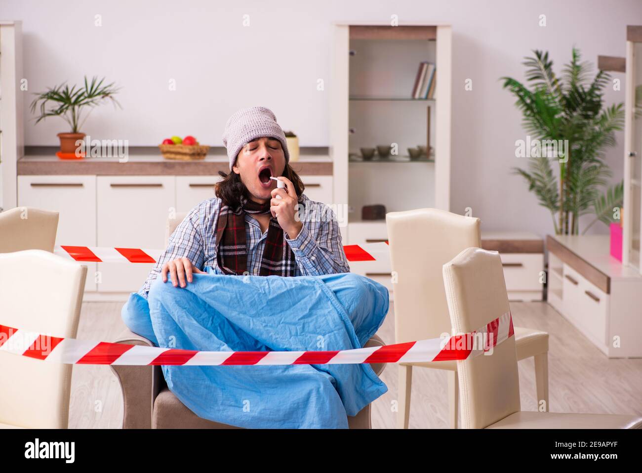 Sick man suffering at home in pandemic concept Stock Photo - Alamy