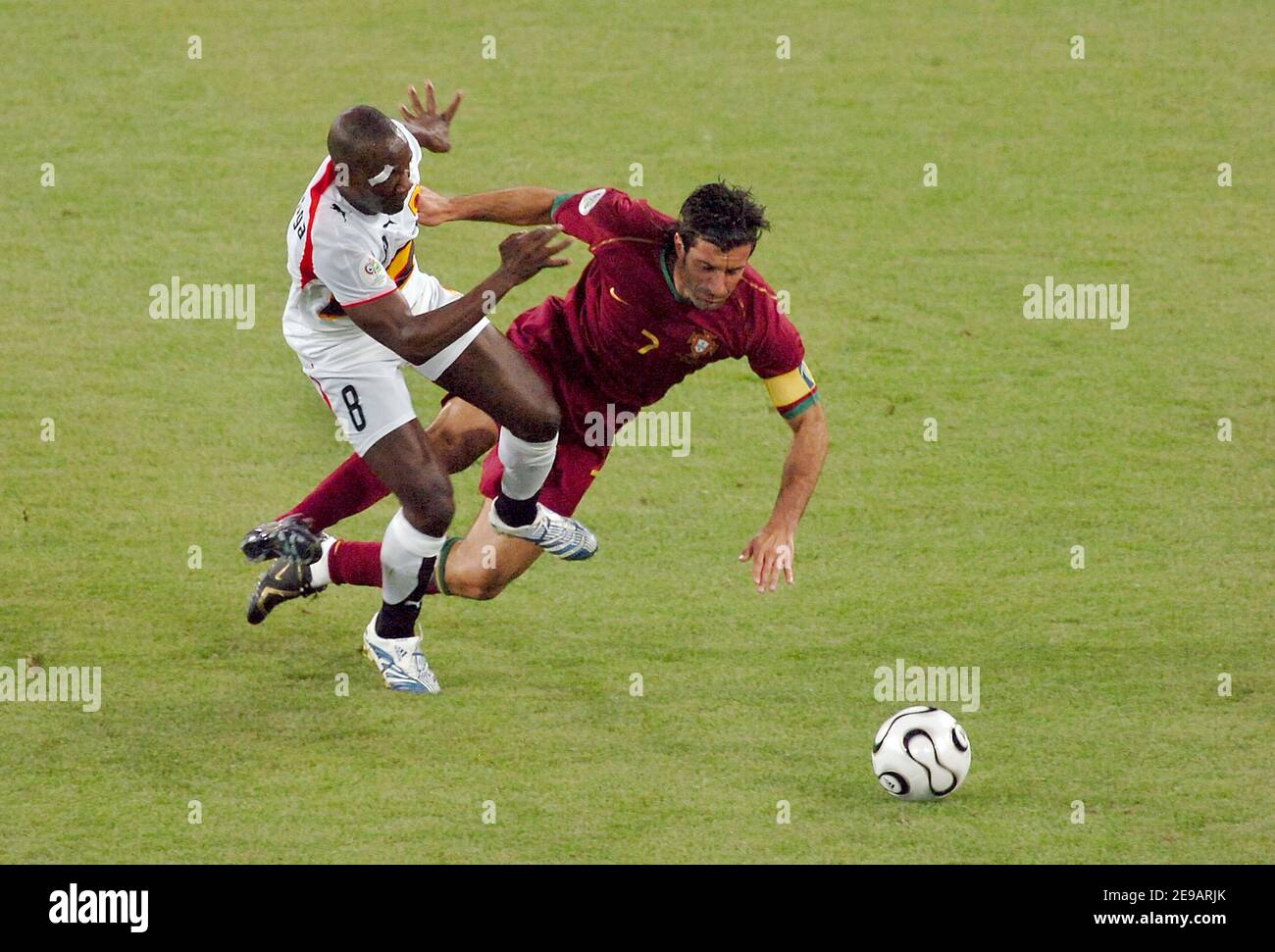 Portugal's Luis Figo and Angola's Figueiredo in action during the World ...