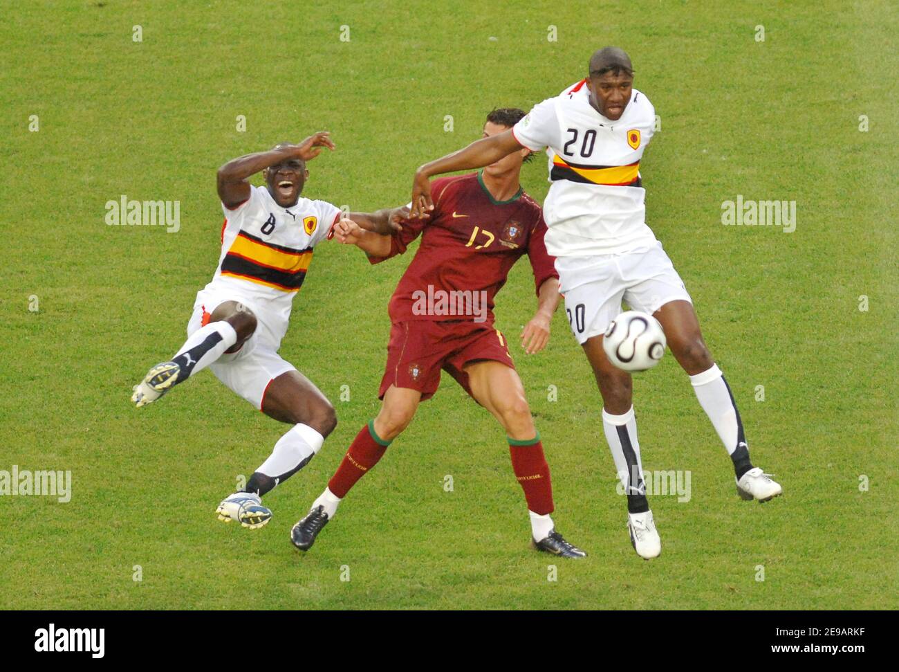 Angola's Andre Macanga, Portugal's Cristiano Ronaldo and Angola's Loco ...