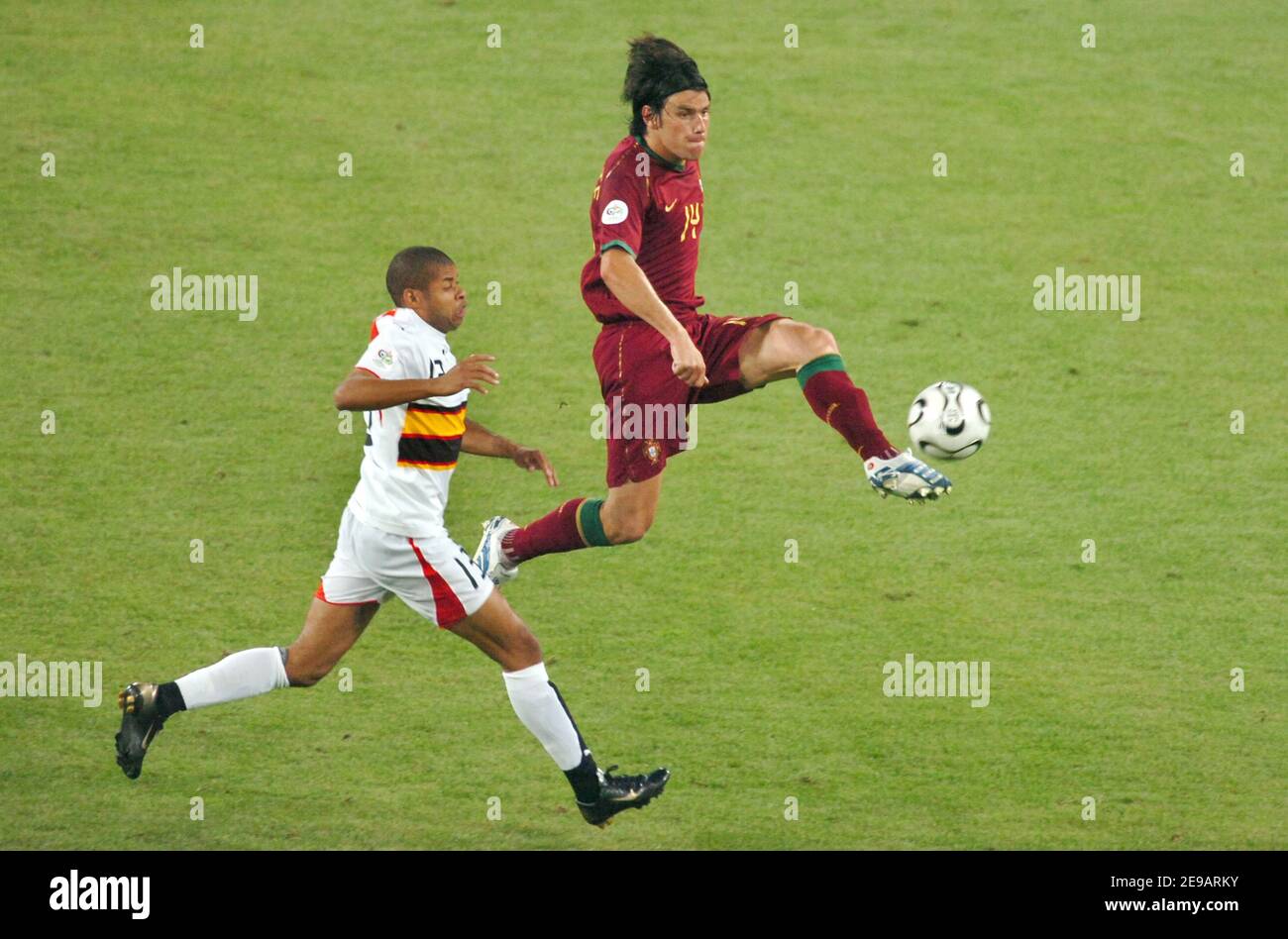 Portugal's Nuno Valente and Angola's Edson in action during the World ...