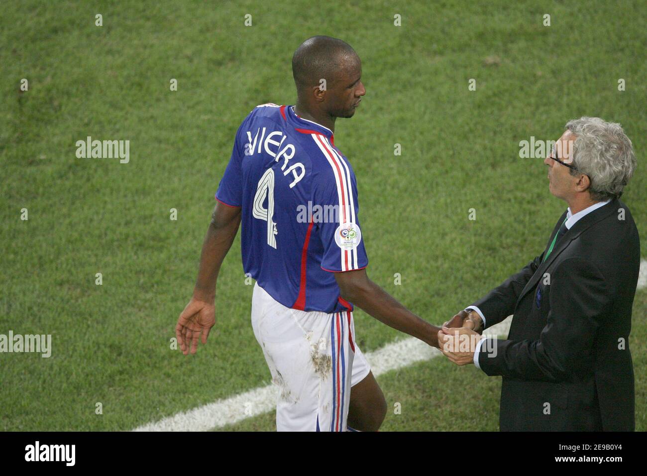 France's Patrick Vieira shakes hand with coach Raymond Domenech during ...