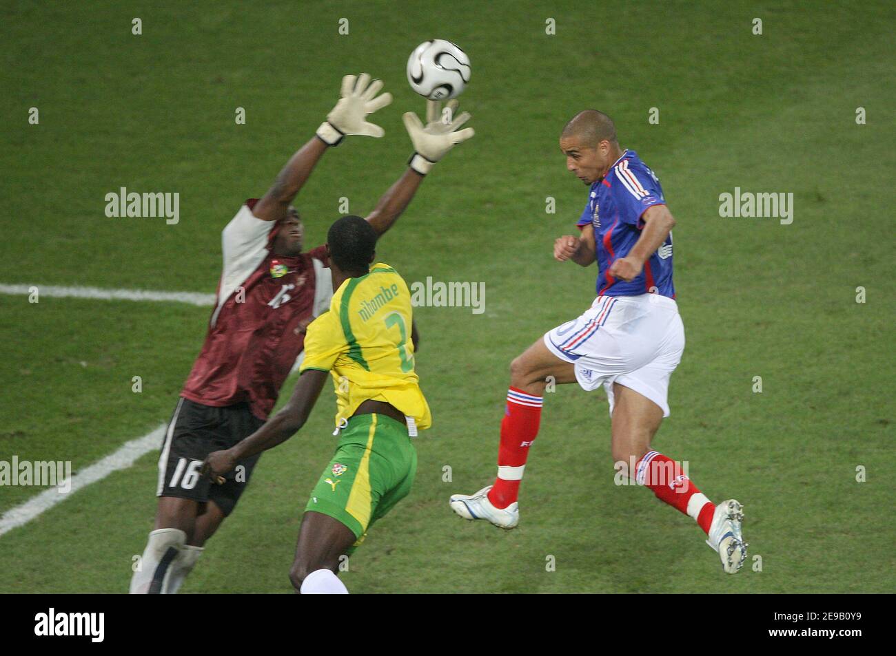 France's David Trezeguet, Togo's Kossi Agassa and Dare Nibombe battle for the ball during the ...