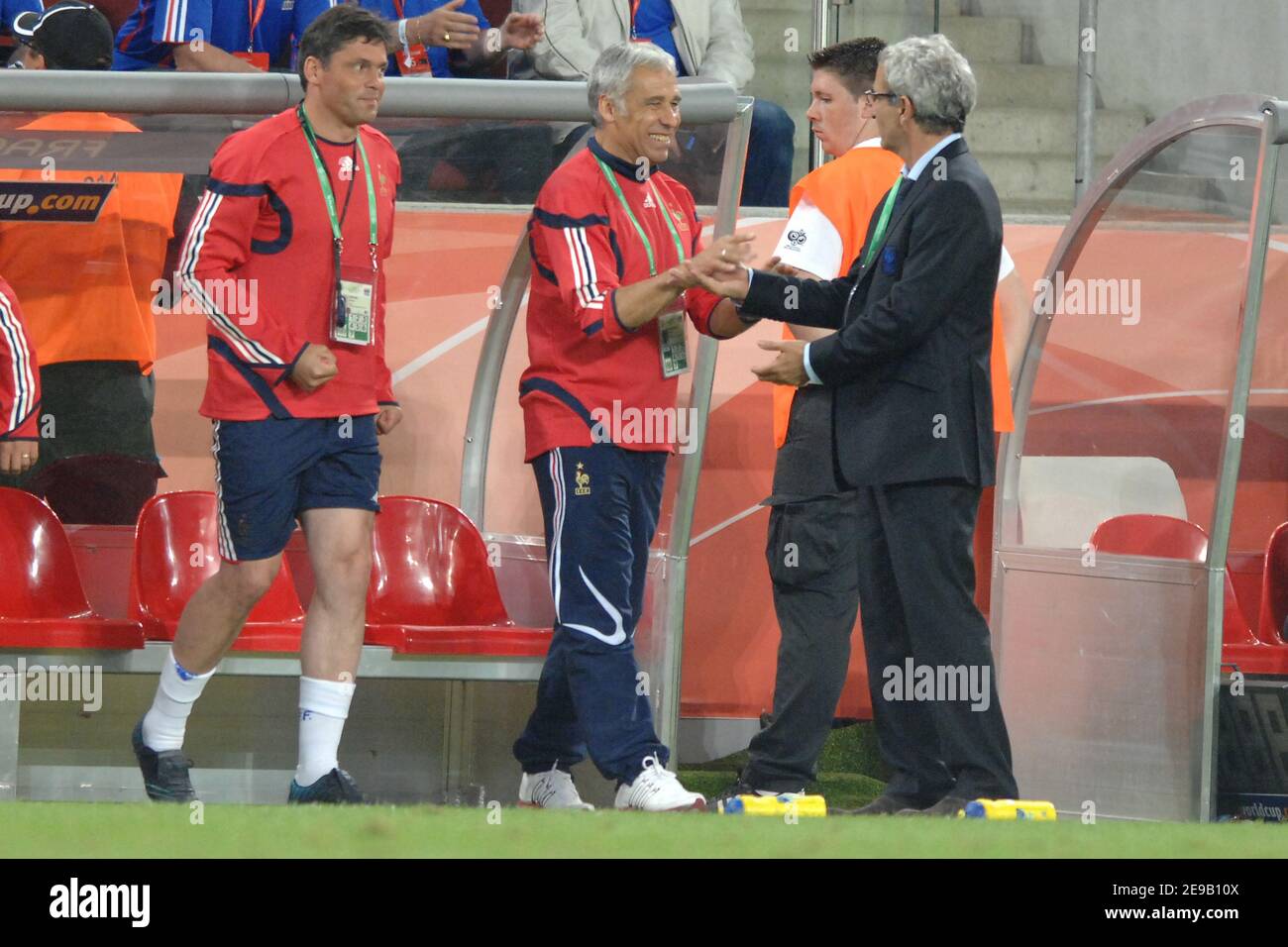 French coach Raymond Domenech celebrates with the technical staff ...